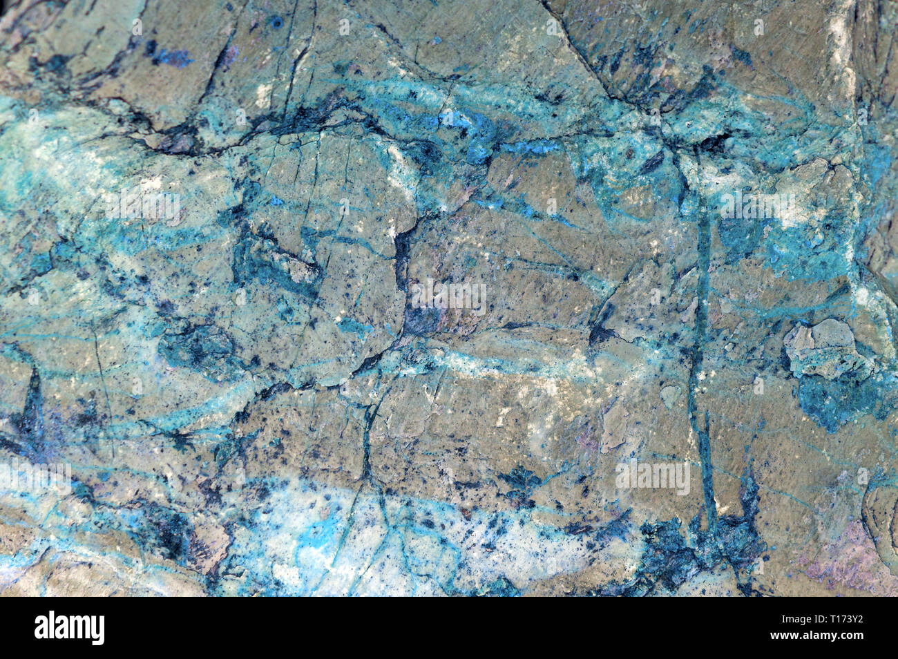 natural mineral grey stone with blue streaks as texture or background ...