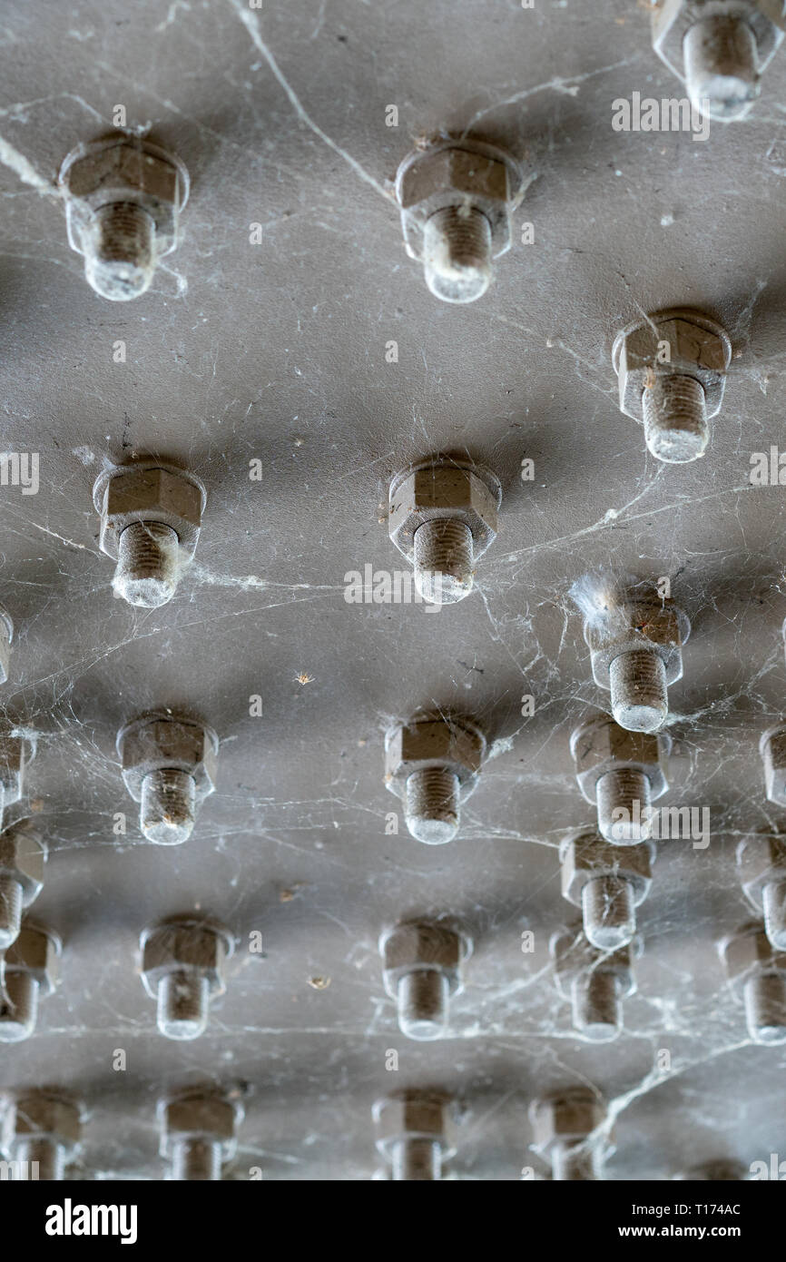 Many huge bolts and nuts connect bridge elements. The concept of a ...