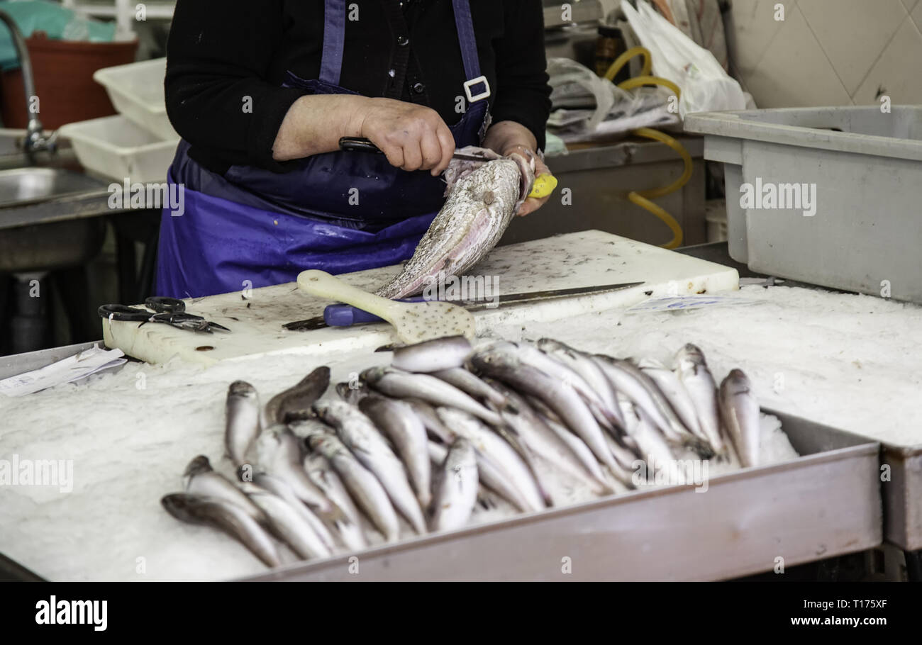 Cleaning fish in a market, healthy food detail Stock Photo - Alamy