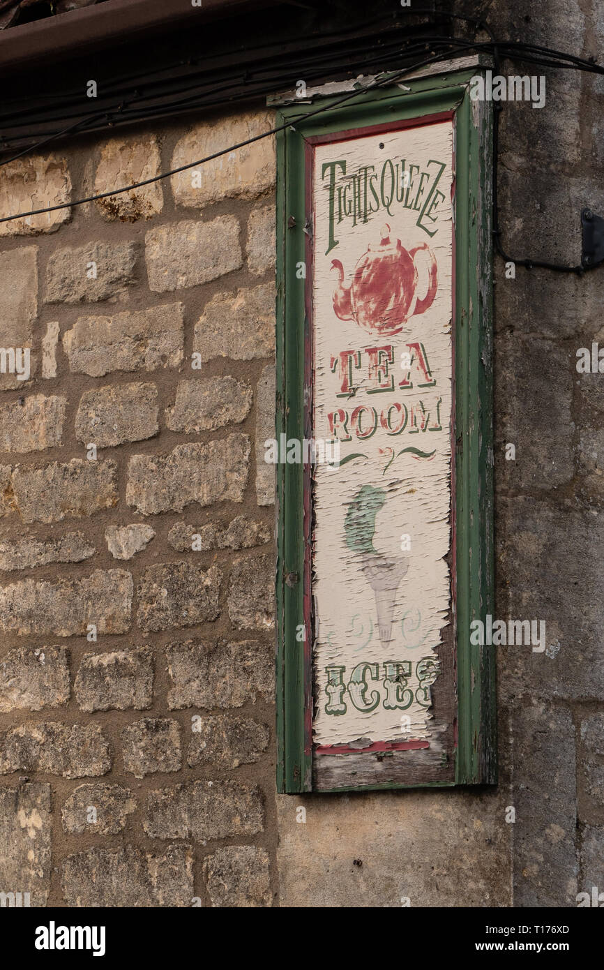 Old, dilapidated and neglected advertising sign for Tightsqueeze Tea ...