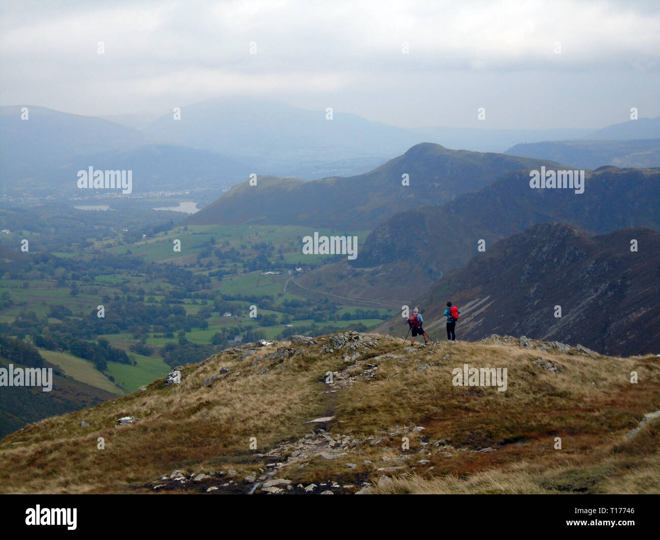 Two Hikers Looking down the Newlands Valley Towards Cat Bells from the ...