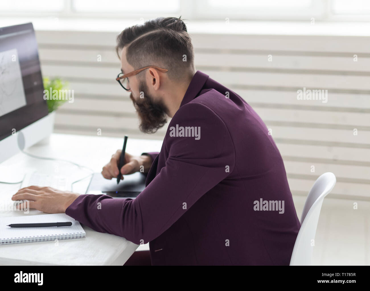 people, design and style concept - graphic designer sketching new ...