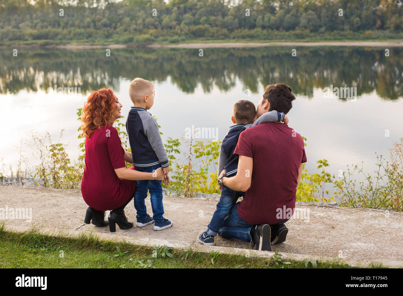 Parenthood, childhood and family concept - Parents and two male ...
