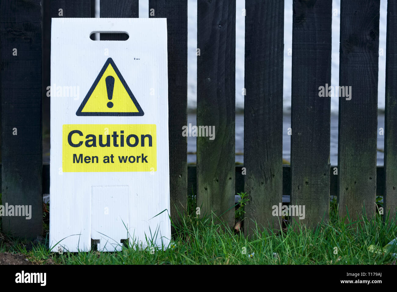 Men at work caution sign Stock Photo - Alamy