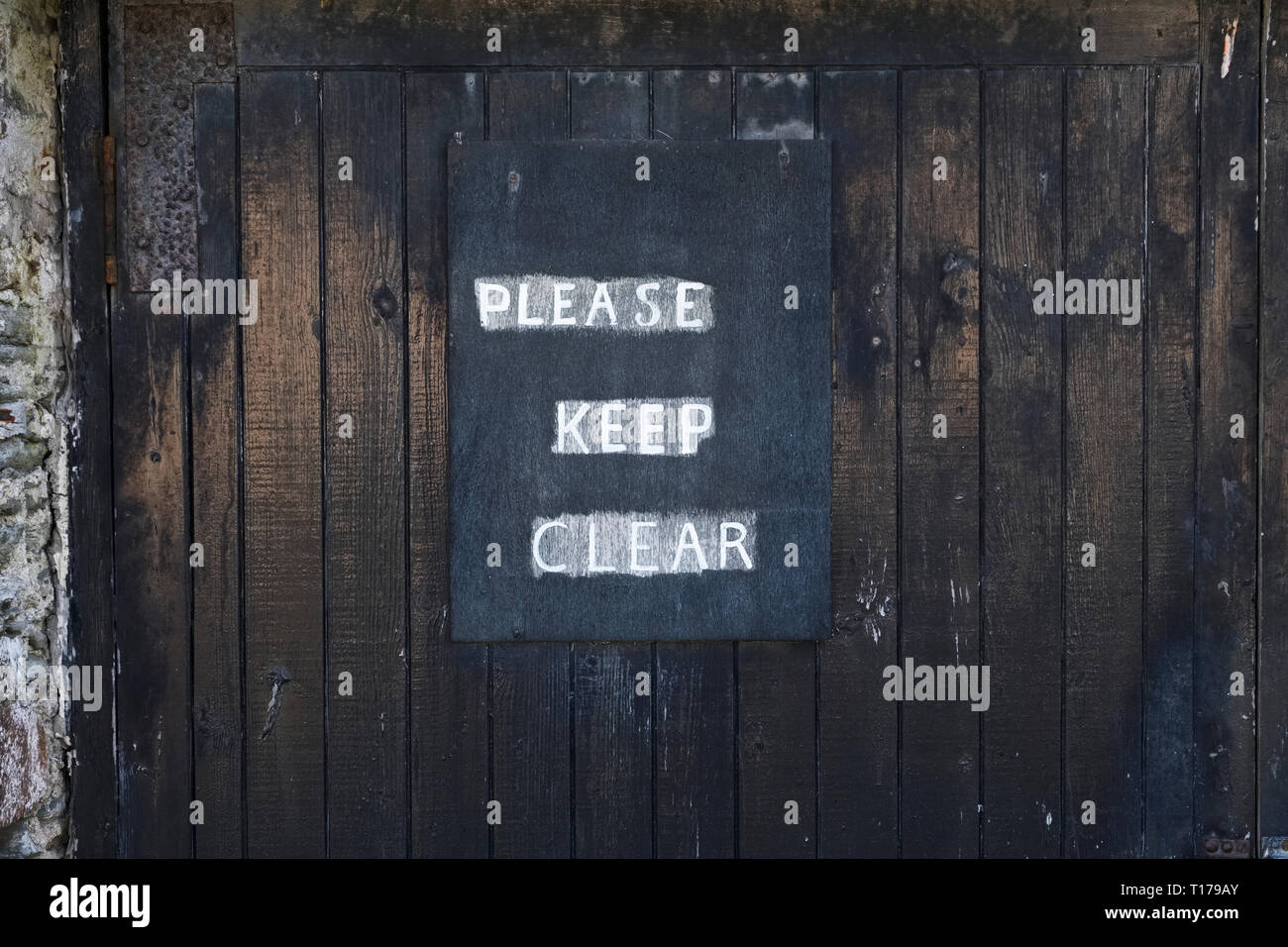 Please keep clear chalk on black board Stock Photo - Alamy