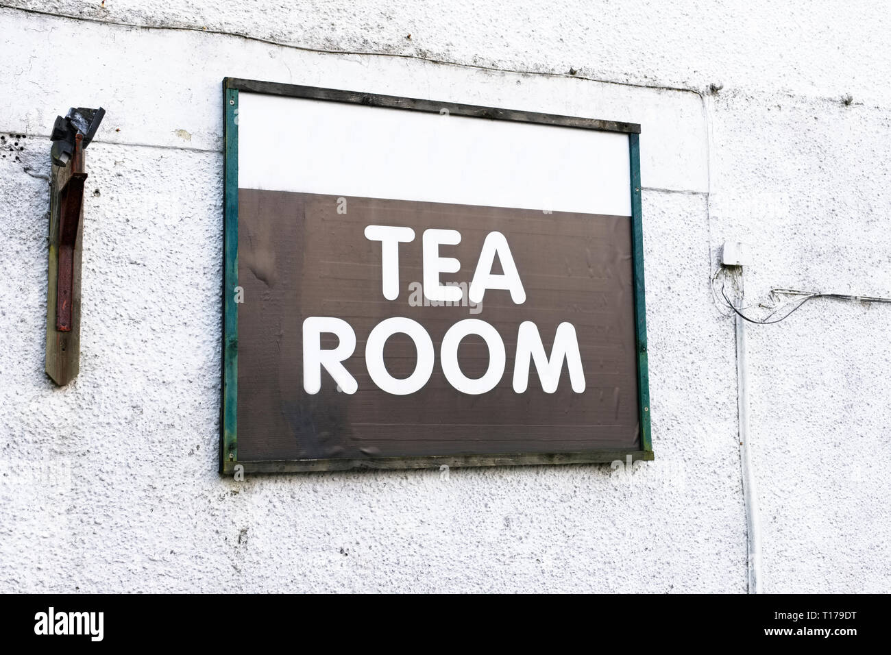 Tea room cafe sign on white wall Stock Photo - Alamy
