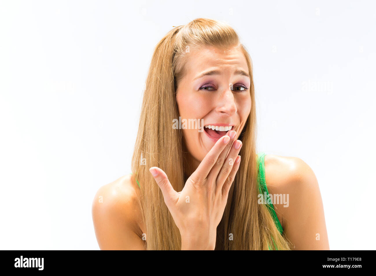 Blonde young woman laughing Stock Photo - Alamy