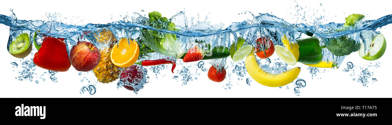 fresh multi fruits and vegetables splashing into blue clear water ...