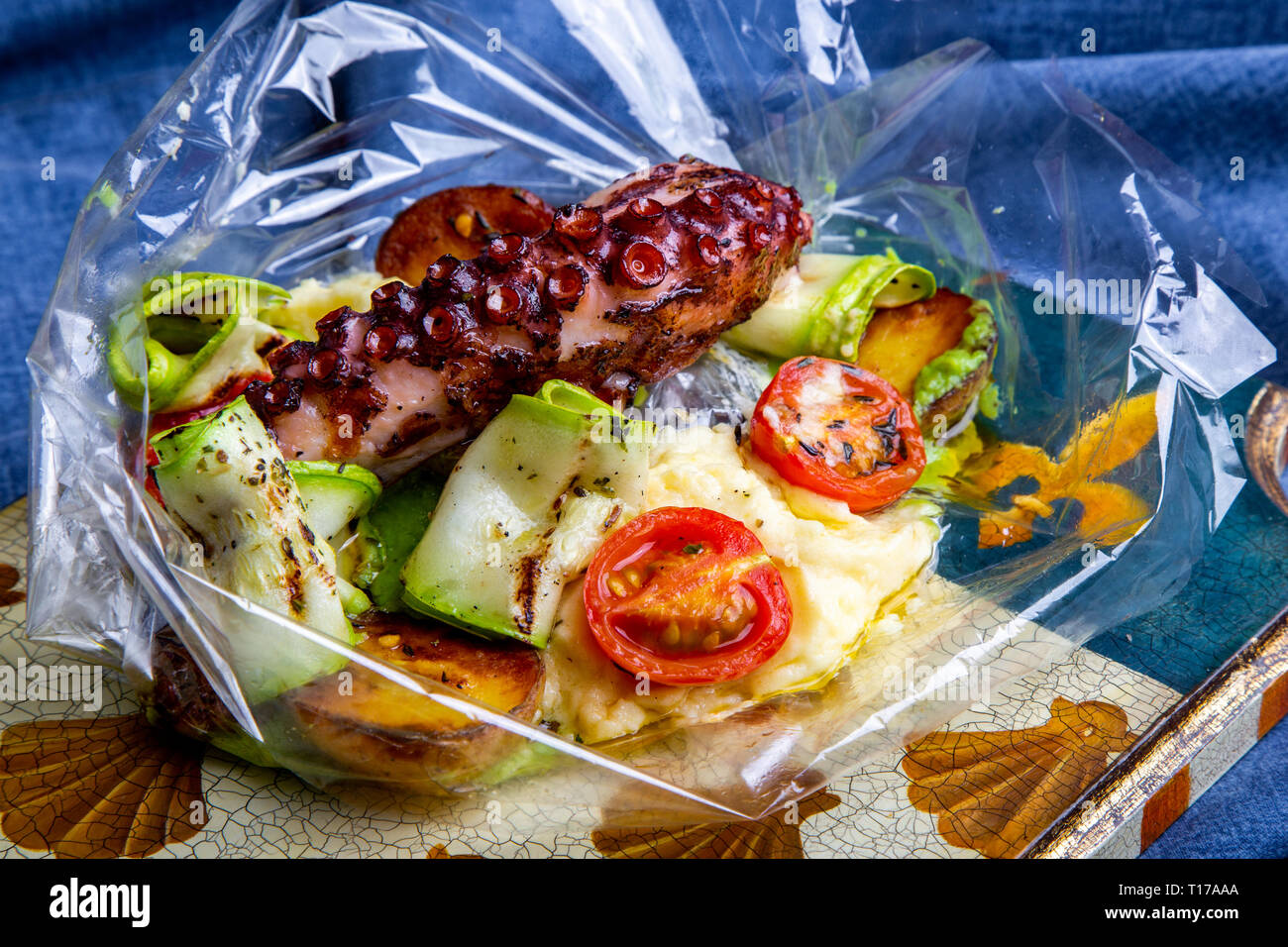 Luxurious seafood platter: octopus with vegetables. Banquet festive ...