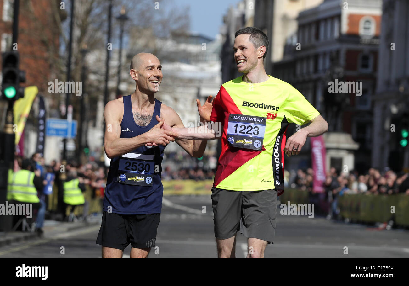 Competitors cross the finish line during the 2019 London Landmarks Half ...