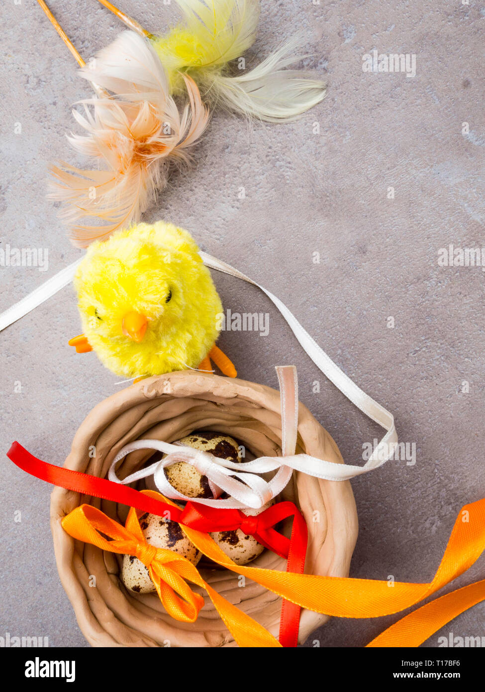 Happy easter background. Easter eggs and yellow chick and clay bowl ...
