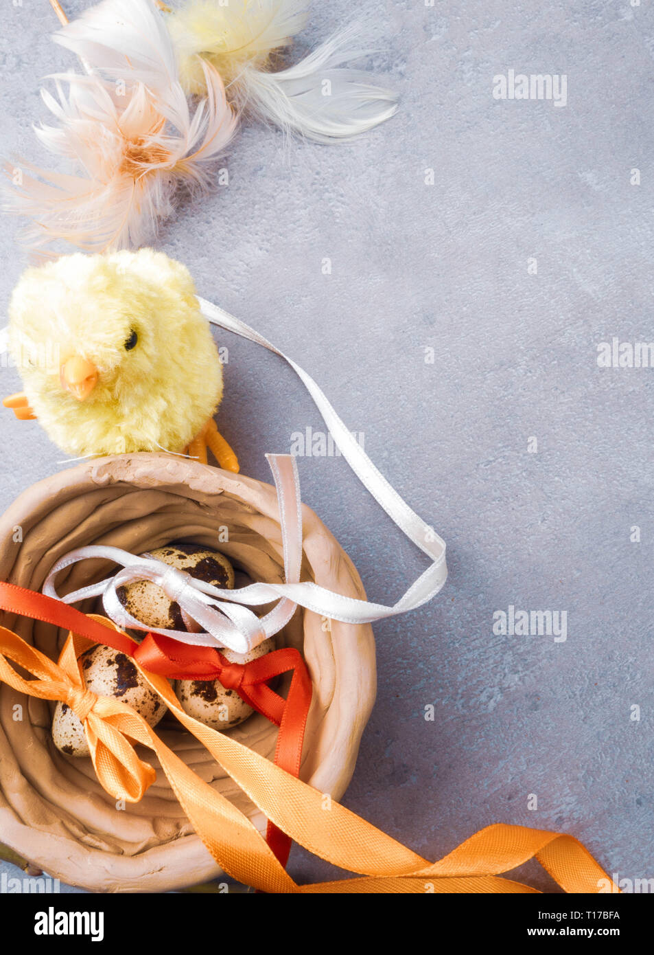 Happy easter background. Easter eggs and yellow chick and clay bowl ...