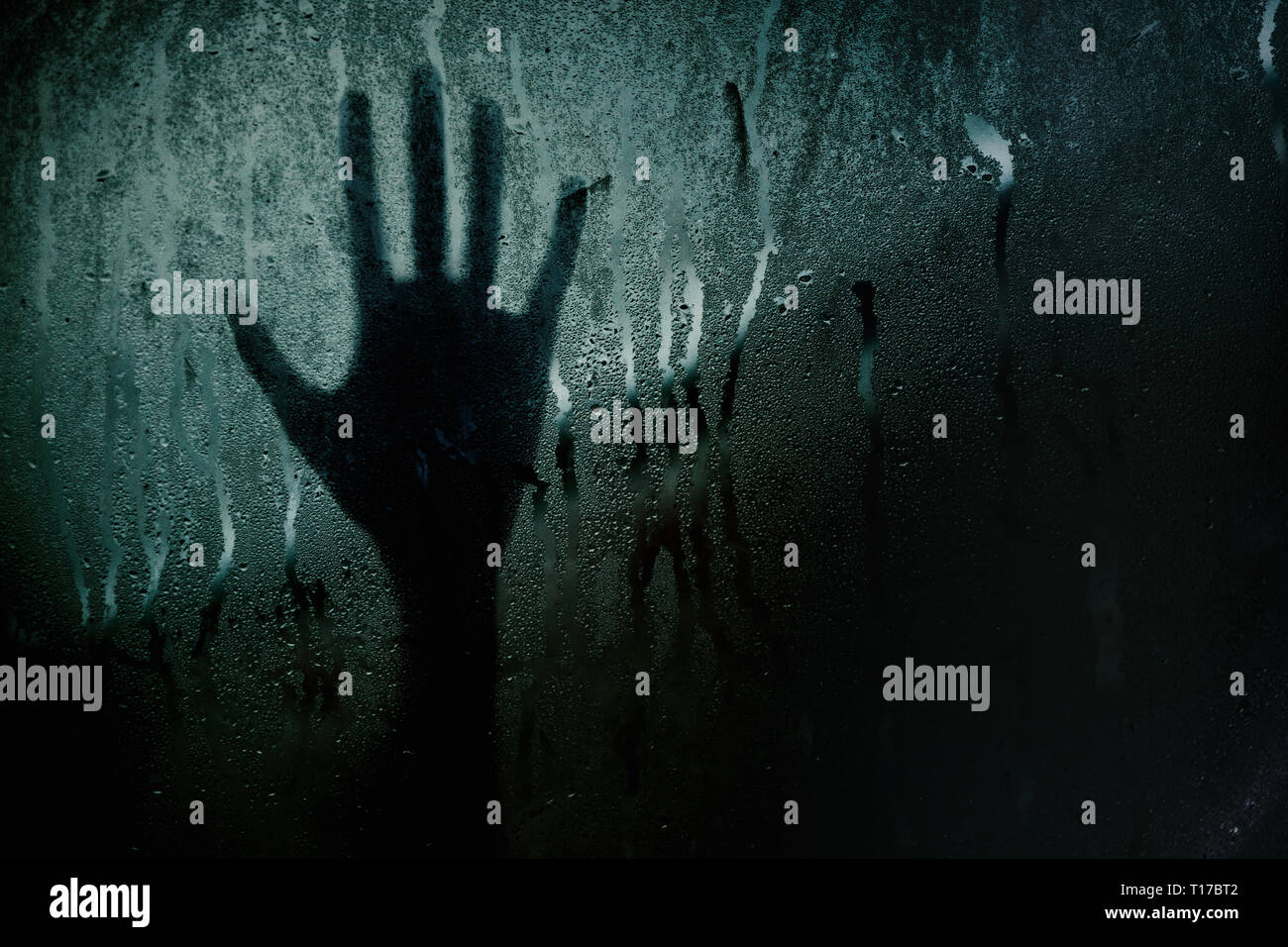 Silhouette Blur hand touching glass or window Stock Photo - Alamy