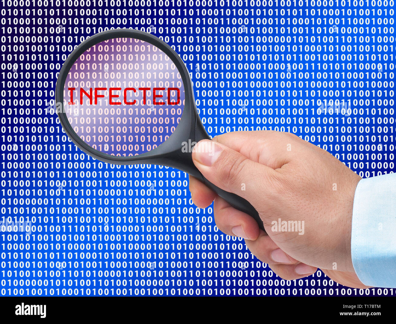 magnifying glass in hand on digital background detecting infection ...