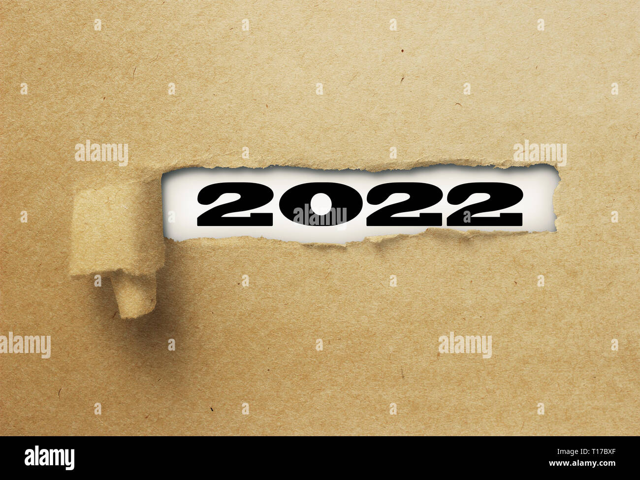 ripped or torn paper revealing new year 2022 on white background Stock ...