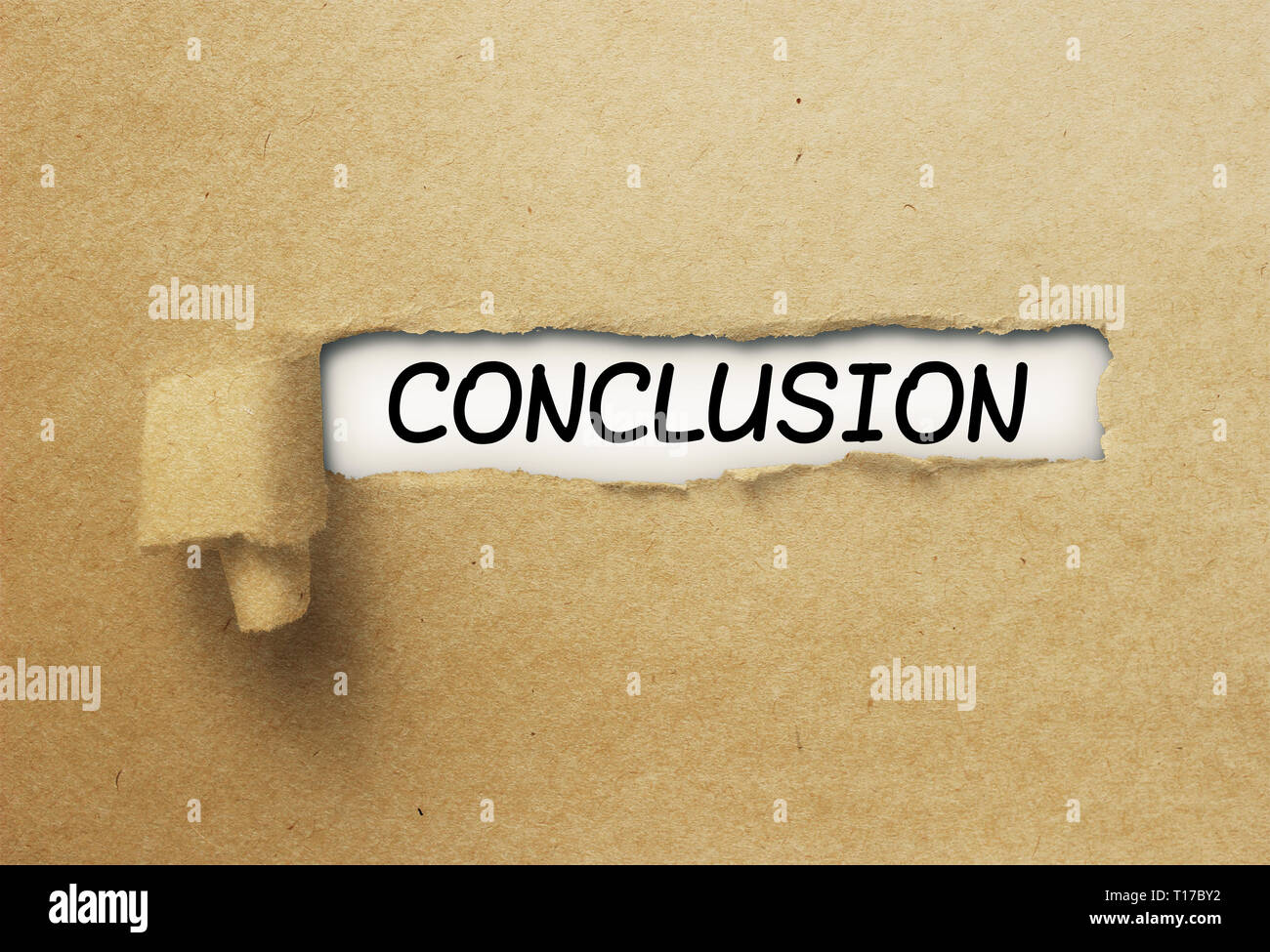 Conclusion behind ripped curl paper Stock Photo - Alamy
