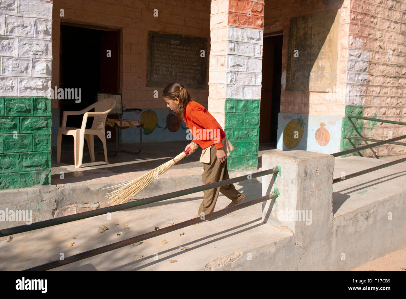 Child sweeping school hi-res stock photography and images - Alamy