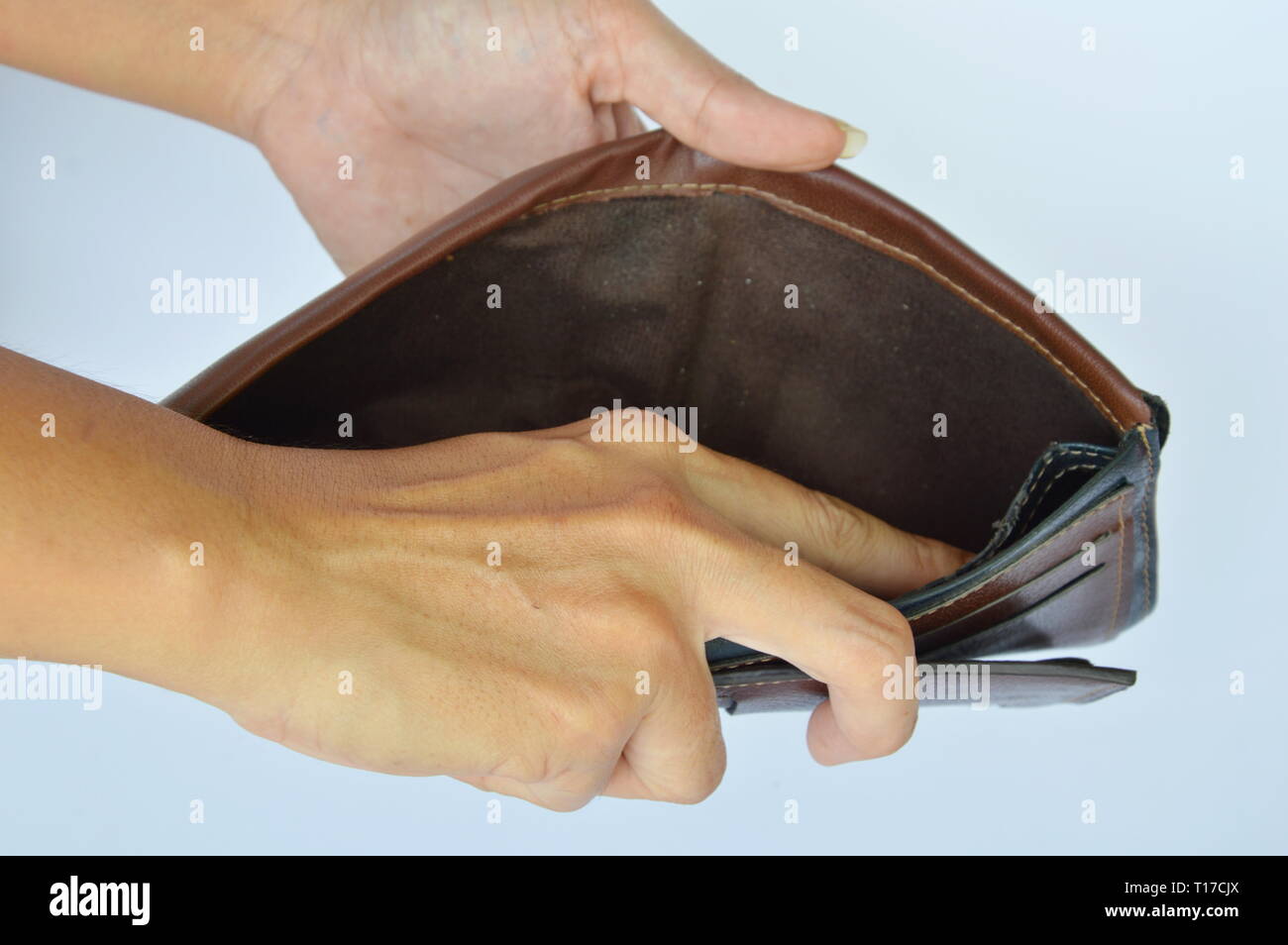 hand try to pick money in wallet but empty Stock Photo - Alamy