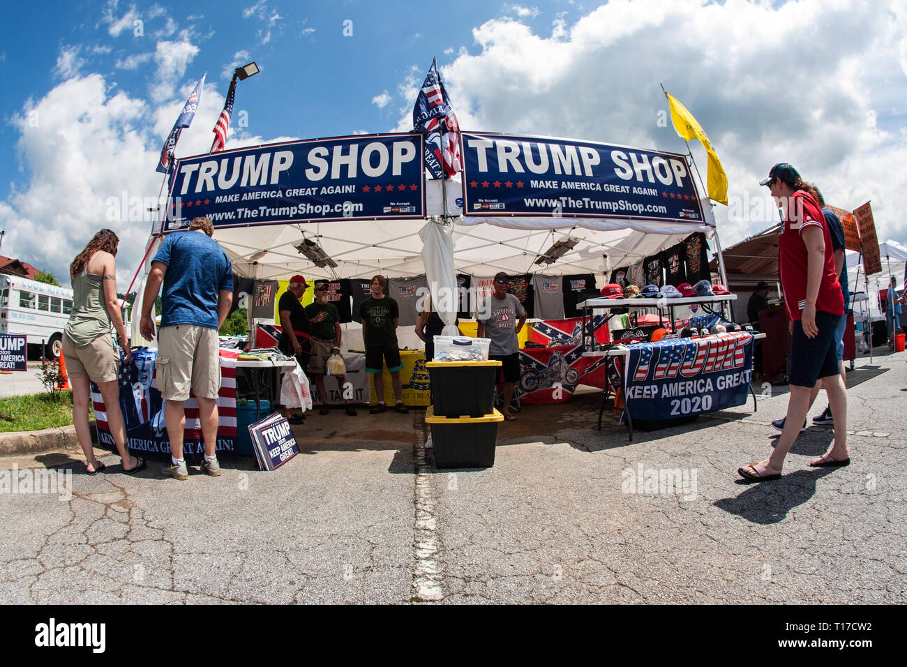 Couples shop for merchandise at the Trump Shop, a popup outdoor store ...