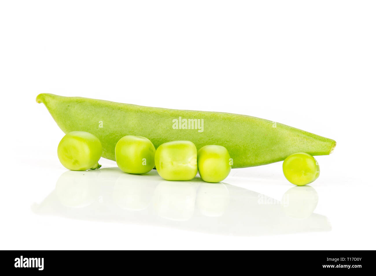One whole green sugar snap pea pod with five peas isolated on white ...