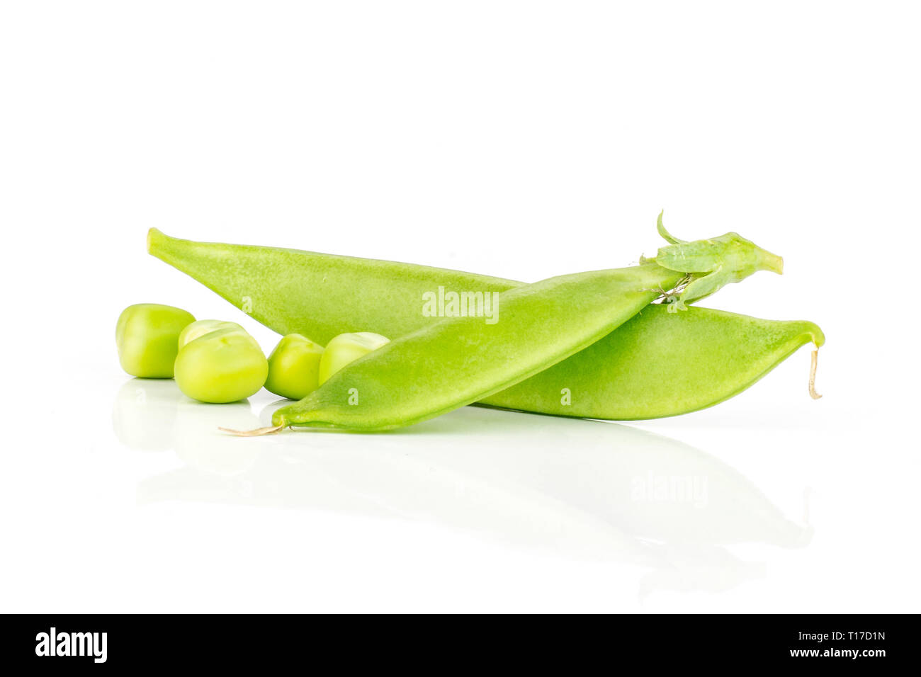 Group of two whole green sugar snap pea pod with three peas isolated on ...