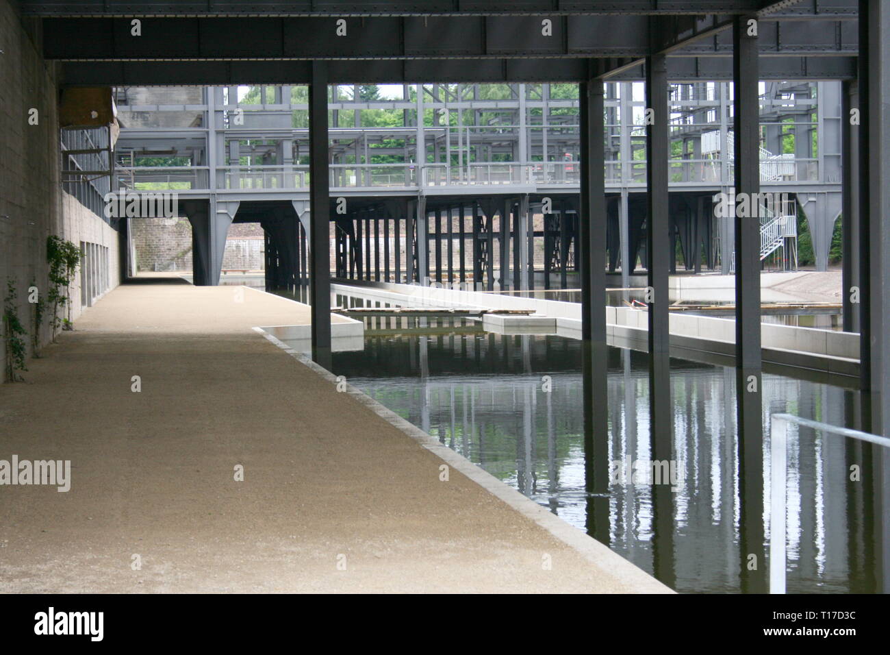 More standing water in steel beams with steel columns resting on it ...