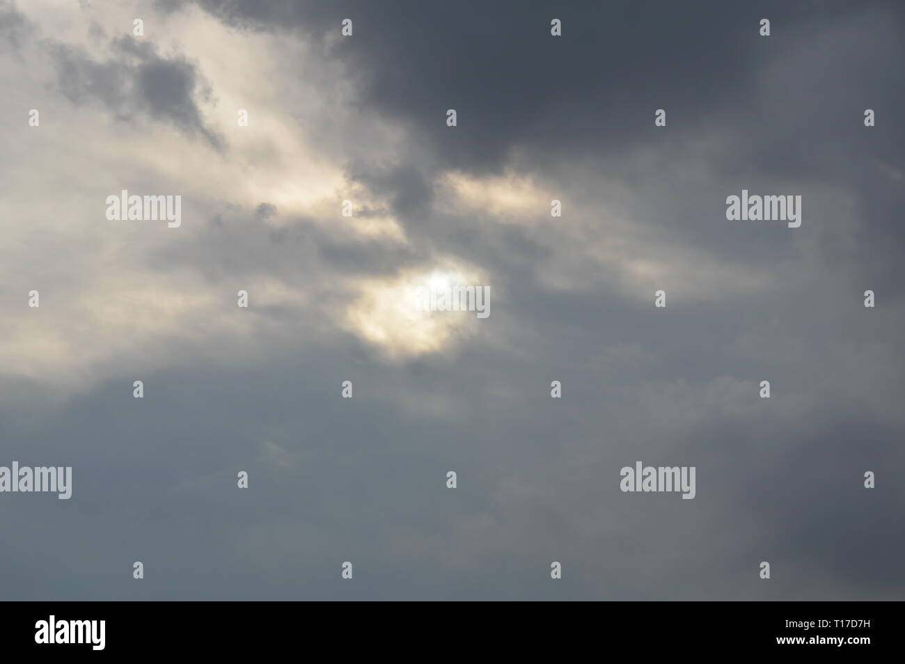 rain cloud hide the sun on dull sky Stock Photo - Alamy