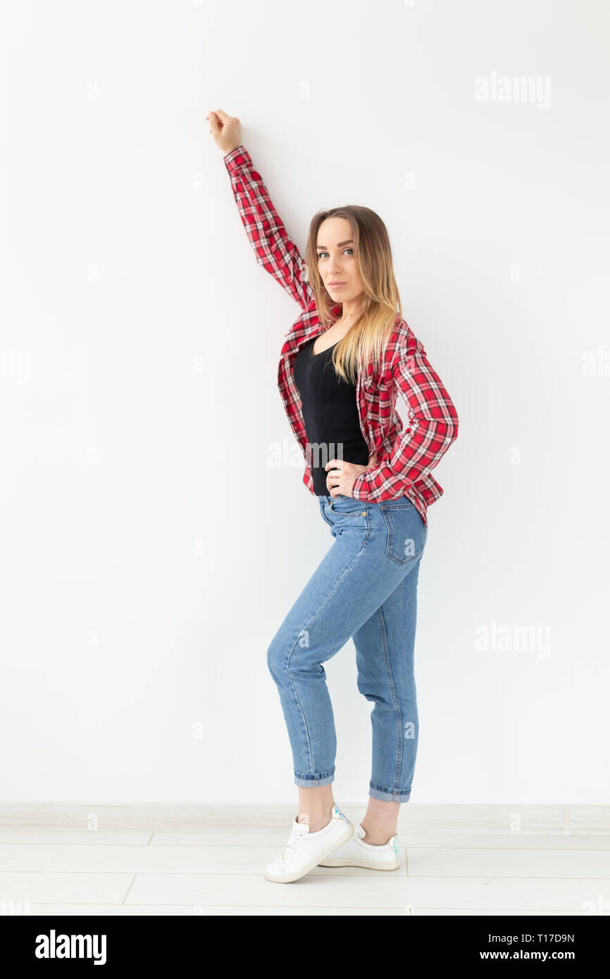 People and fashion concept - Full length image of woman posing sideways ...