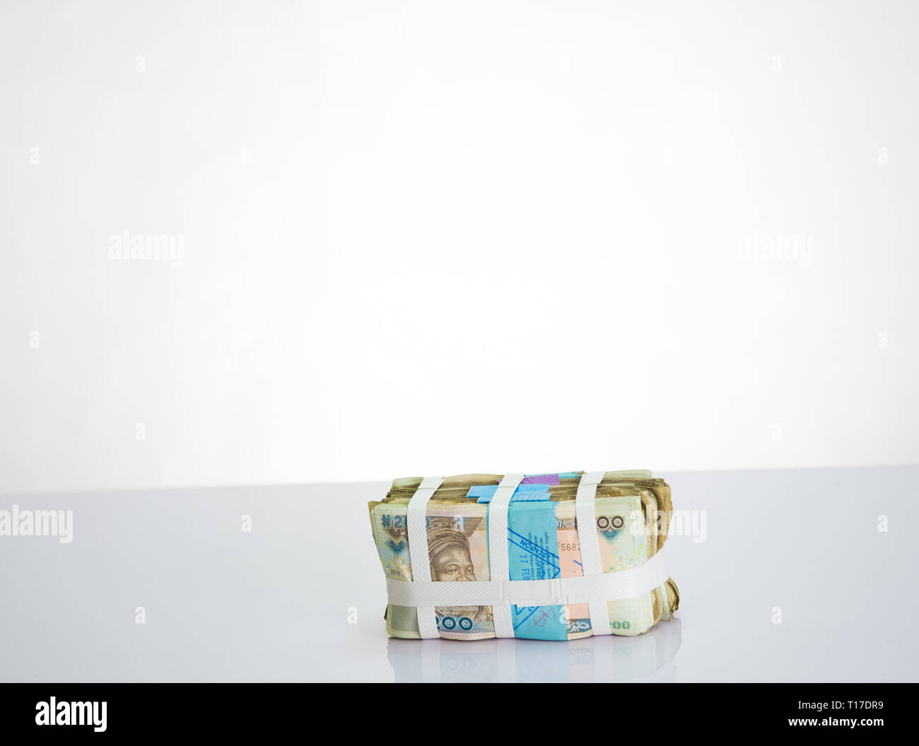 Stack of nigeria naira notes on white background Stock Photo - Alamy