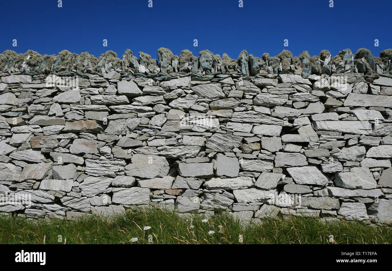 Traditional dry stone wall with blue sky near Rhoscolyn, Anglesey ...
