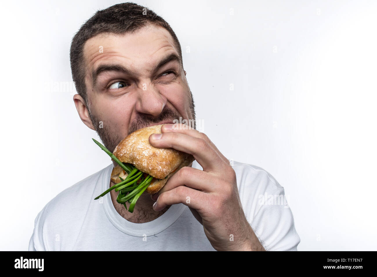 Man eating messy hamburger hi-res stock photography and images - Alamy