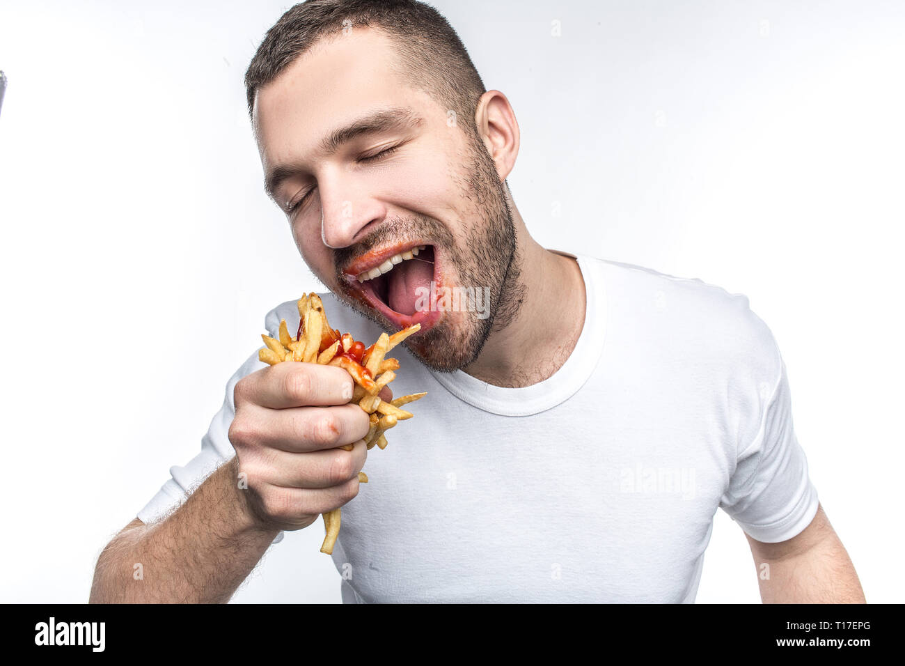 Man eating sandwich dirty hands hi-res stock photography and images - Alamy
