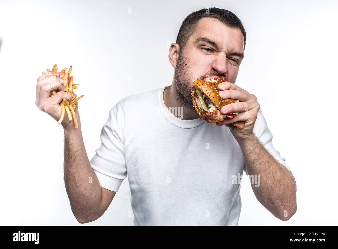 Man biting sandwich hi-res stock photography and images - Alamy