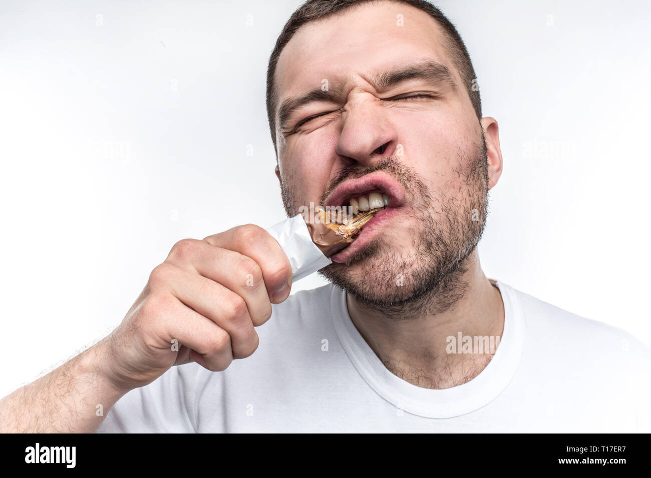 Fat boy eating chocolate hi-res stock photography and images - Alamy