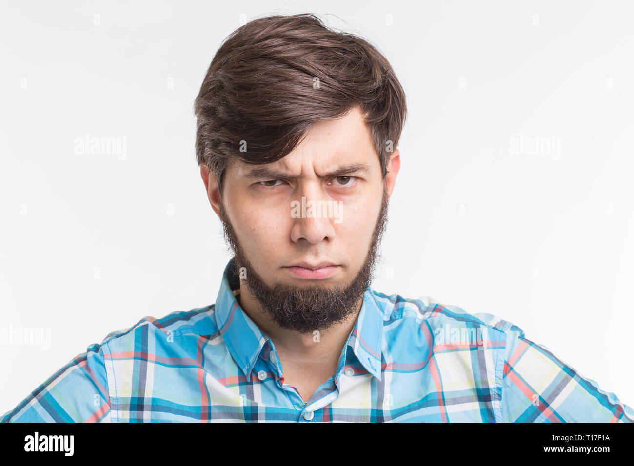 People, gesture and emotions concept - Sad or angry bearded man on ...