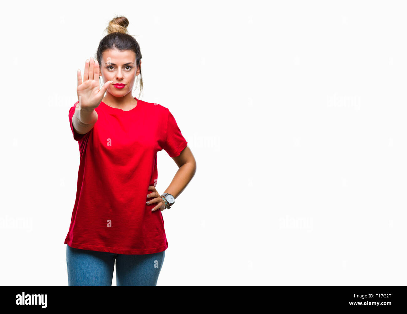 Young beautiful woman over isolated background doing stop sing with ...