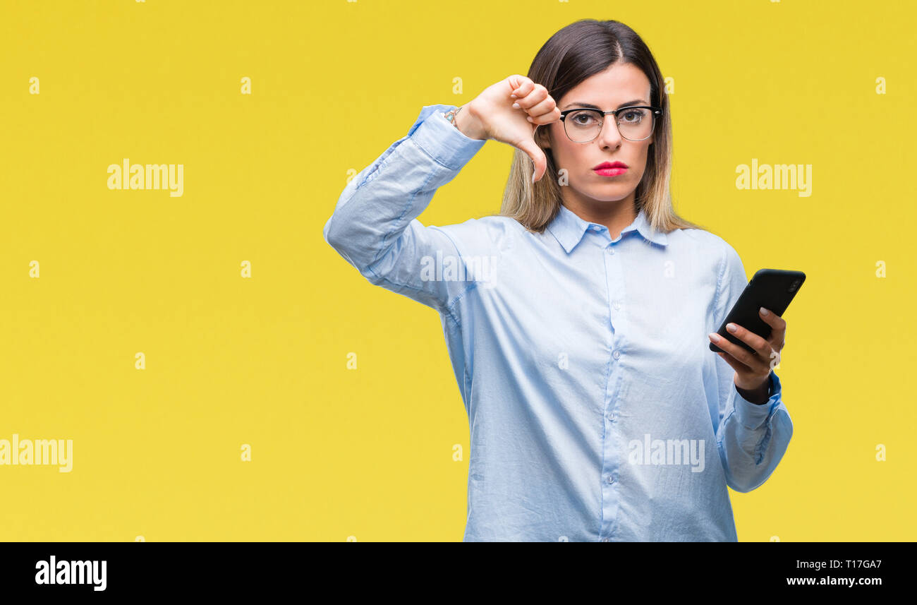 Young beautiful business woman texting message using smartphone over ...