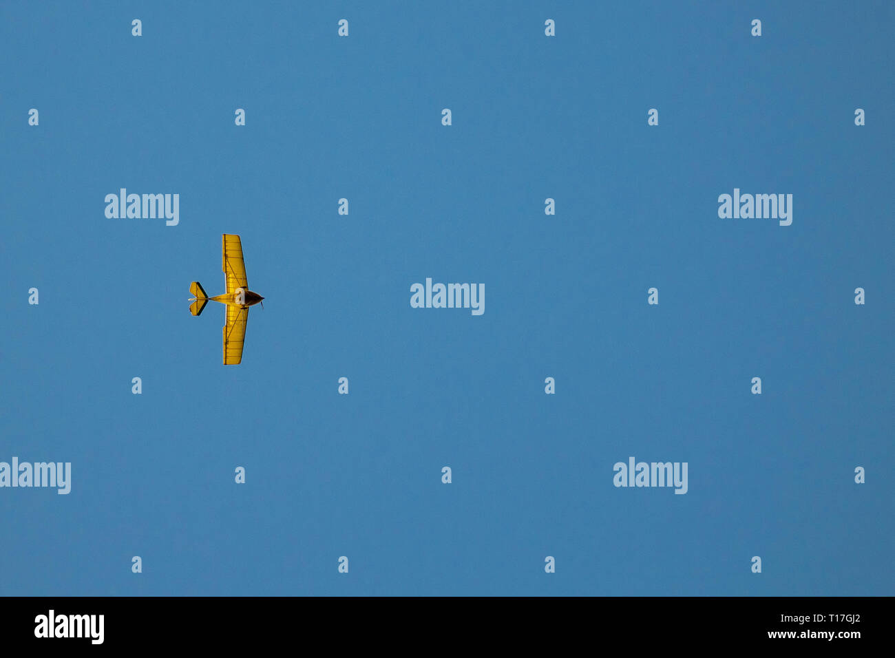 Aircraft Flying In Clear Blue Sky Stock Photo - Alamy