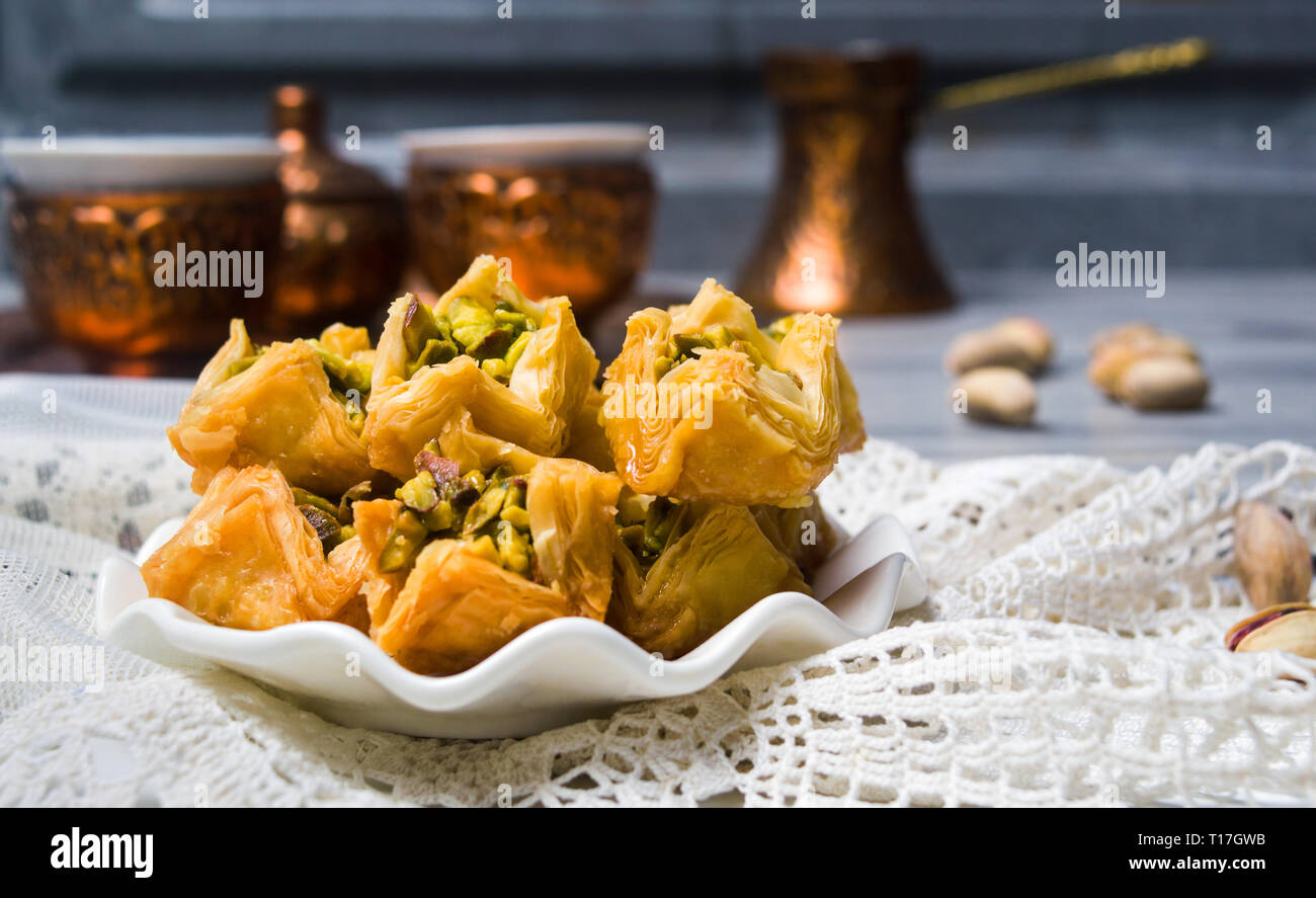 Arabic baklava dessert with coffee in copper cups Stock Photo - Alamy