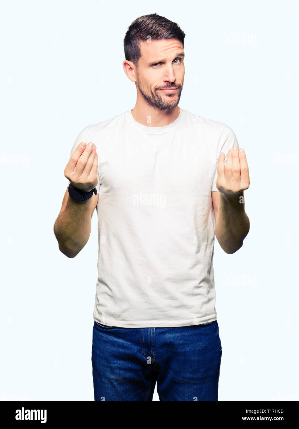 Handsome man wearing casual white t-shirt Doing money gesture with hand ...
