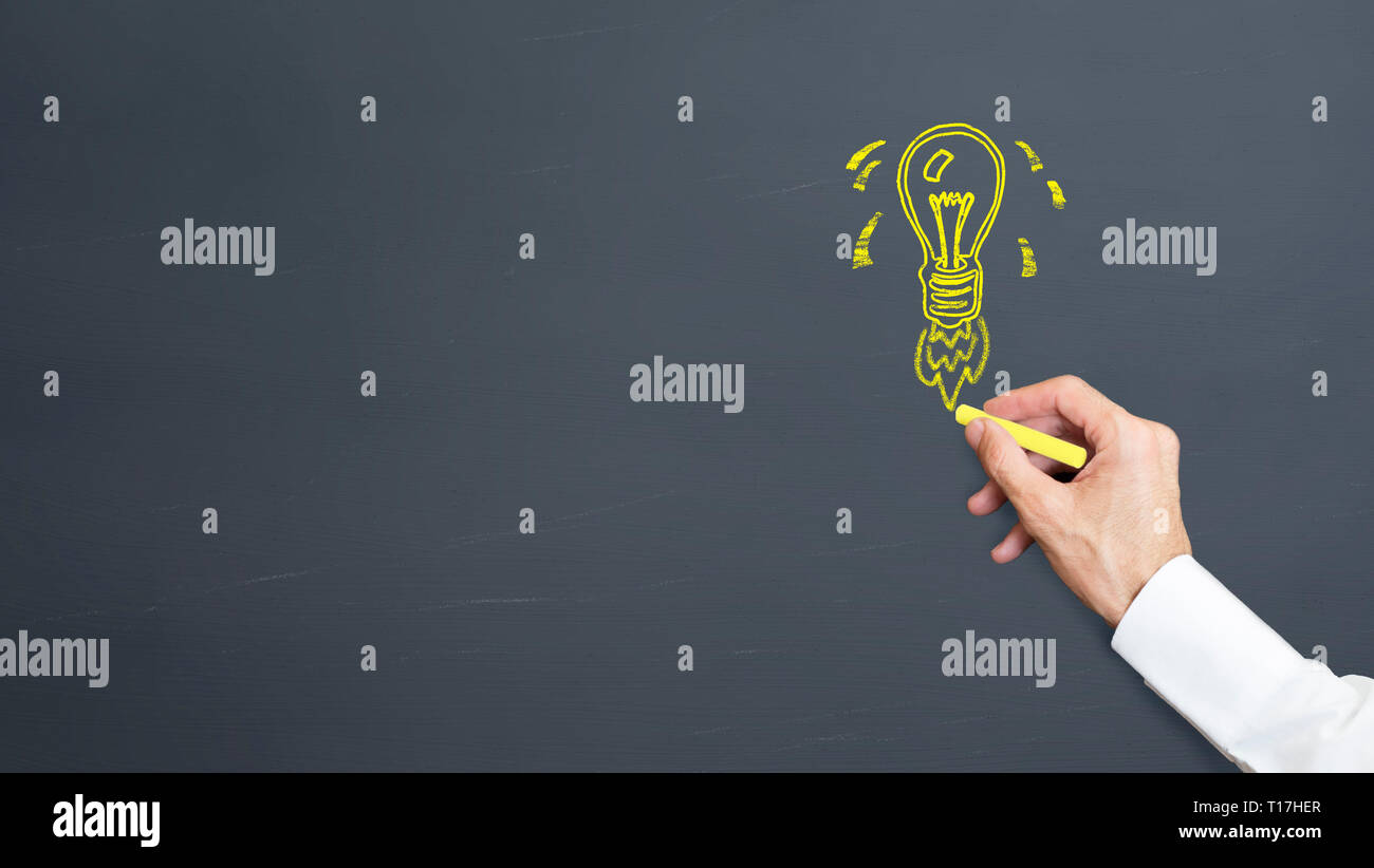 hand drawing yellow jet bulb on blackboard with chalk Stock Photo - Alamy