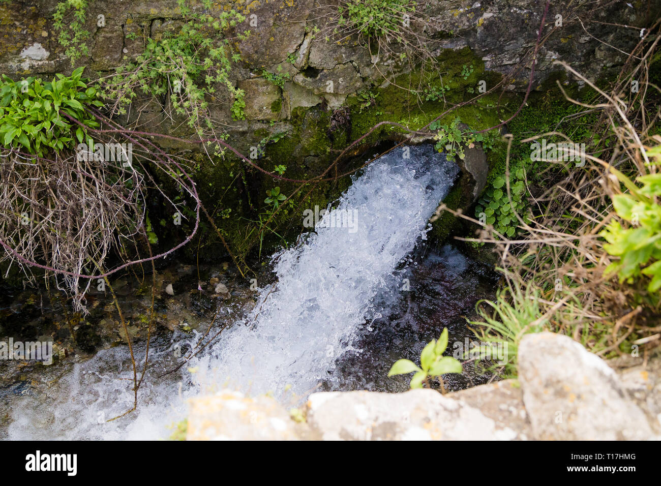 Water runs out of pipe and flows into a gulley that ends up in Lulworth ...