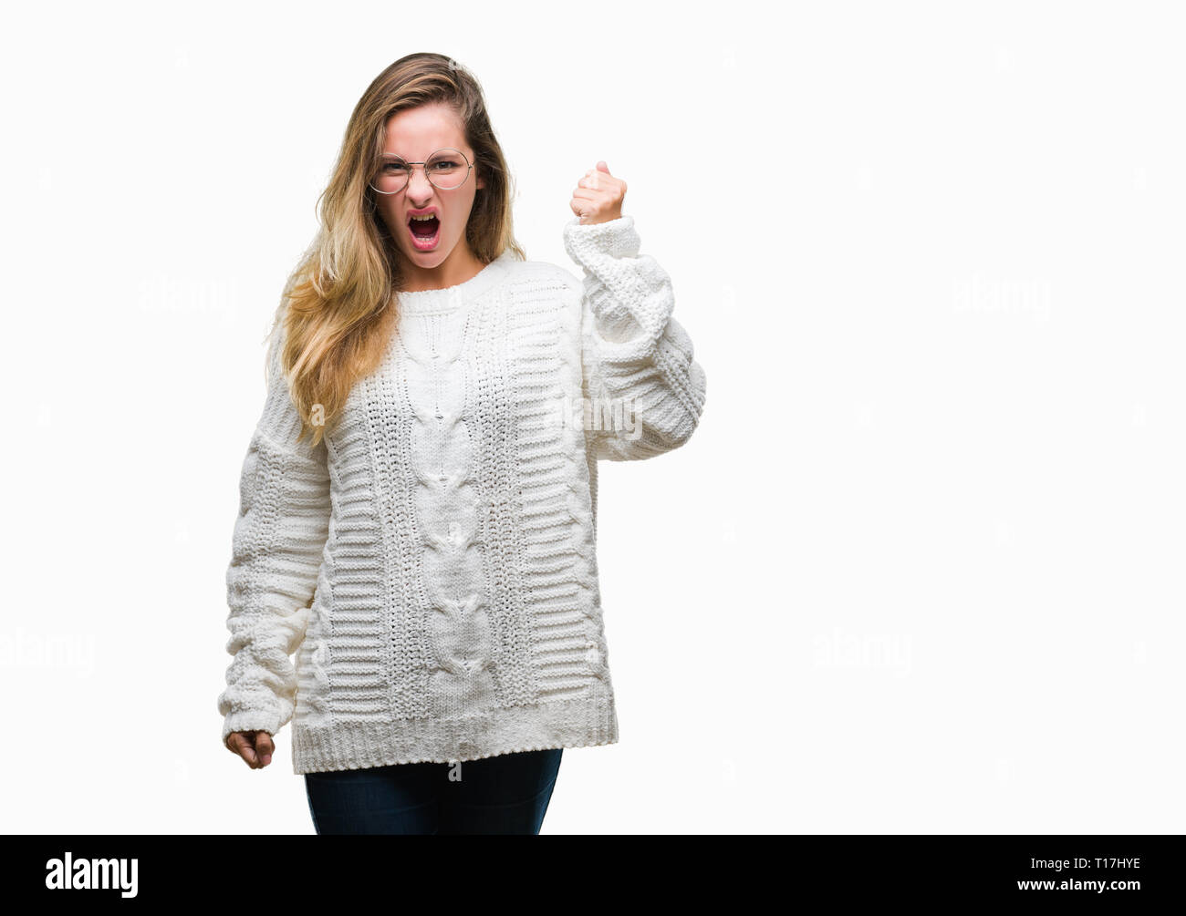 Young beautiful blonde woman wearing winter sweater and sunglasses over ...