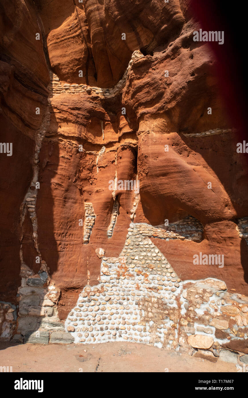 Retaining work on a soft red sandstone cliff at Sidmouth, Devon. Pebble ...