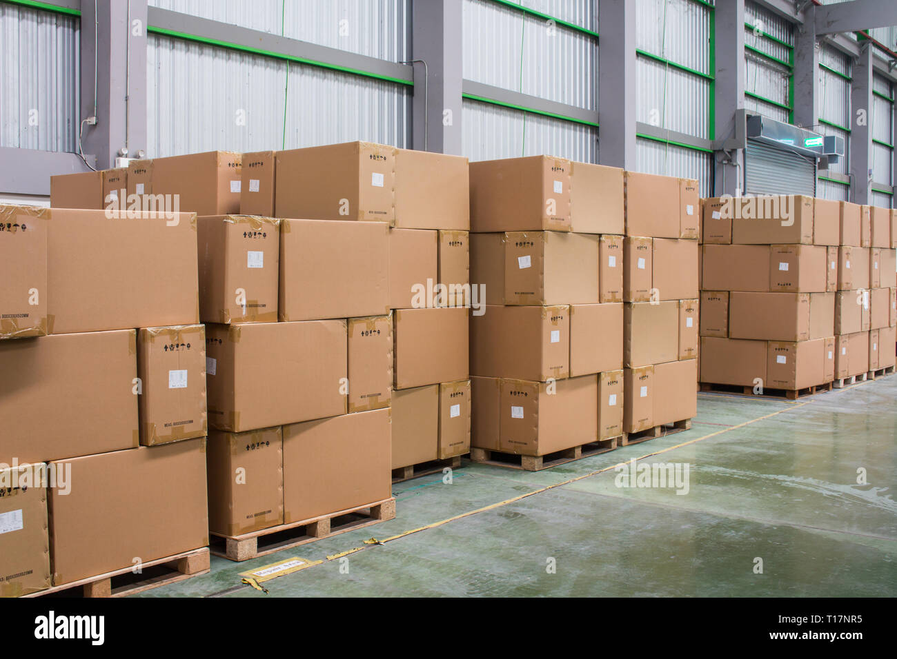 Rows of material boxes or product boxes in warehouse area Stock Photo ...