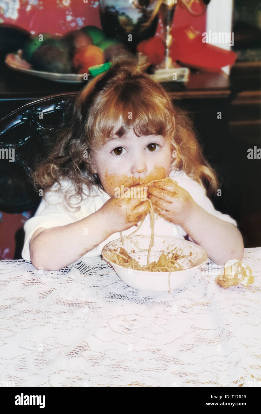 Cute funny messy toddler girl age 2 with long curly blonde hair and big ...