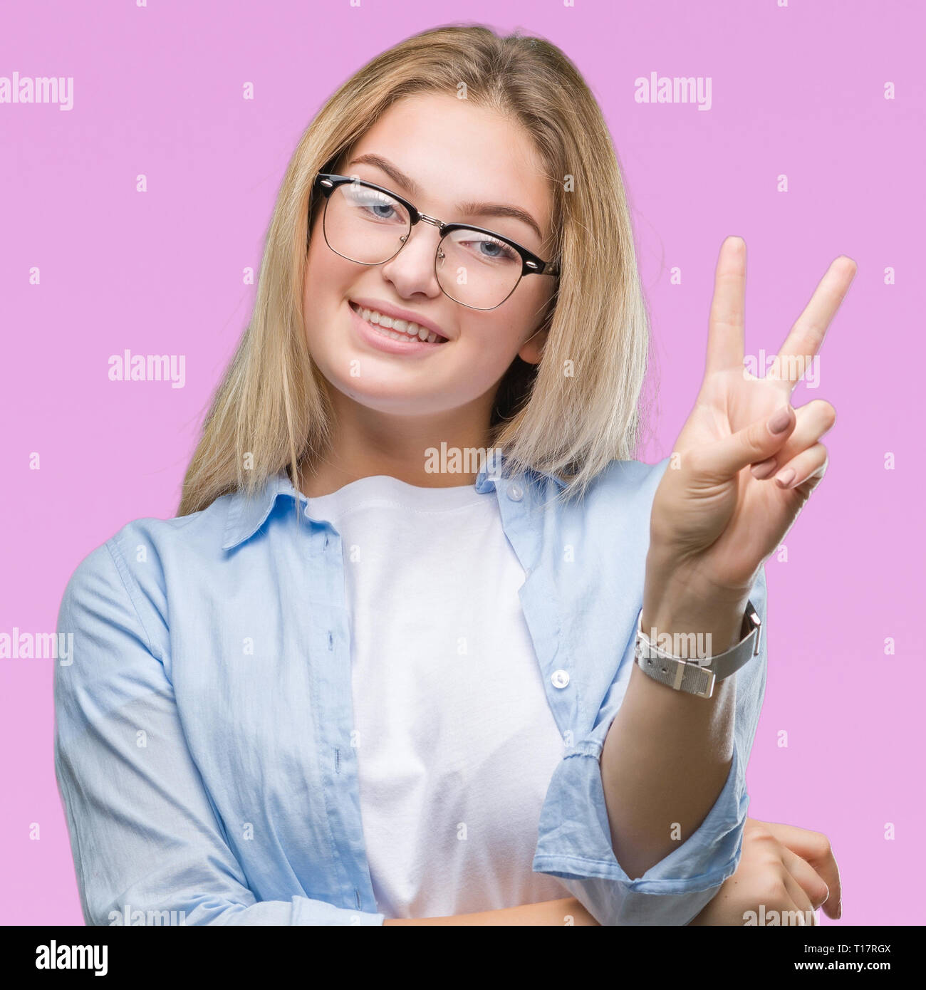 Young caucasian business woman wearing glasses over isolated background ...
