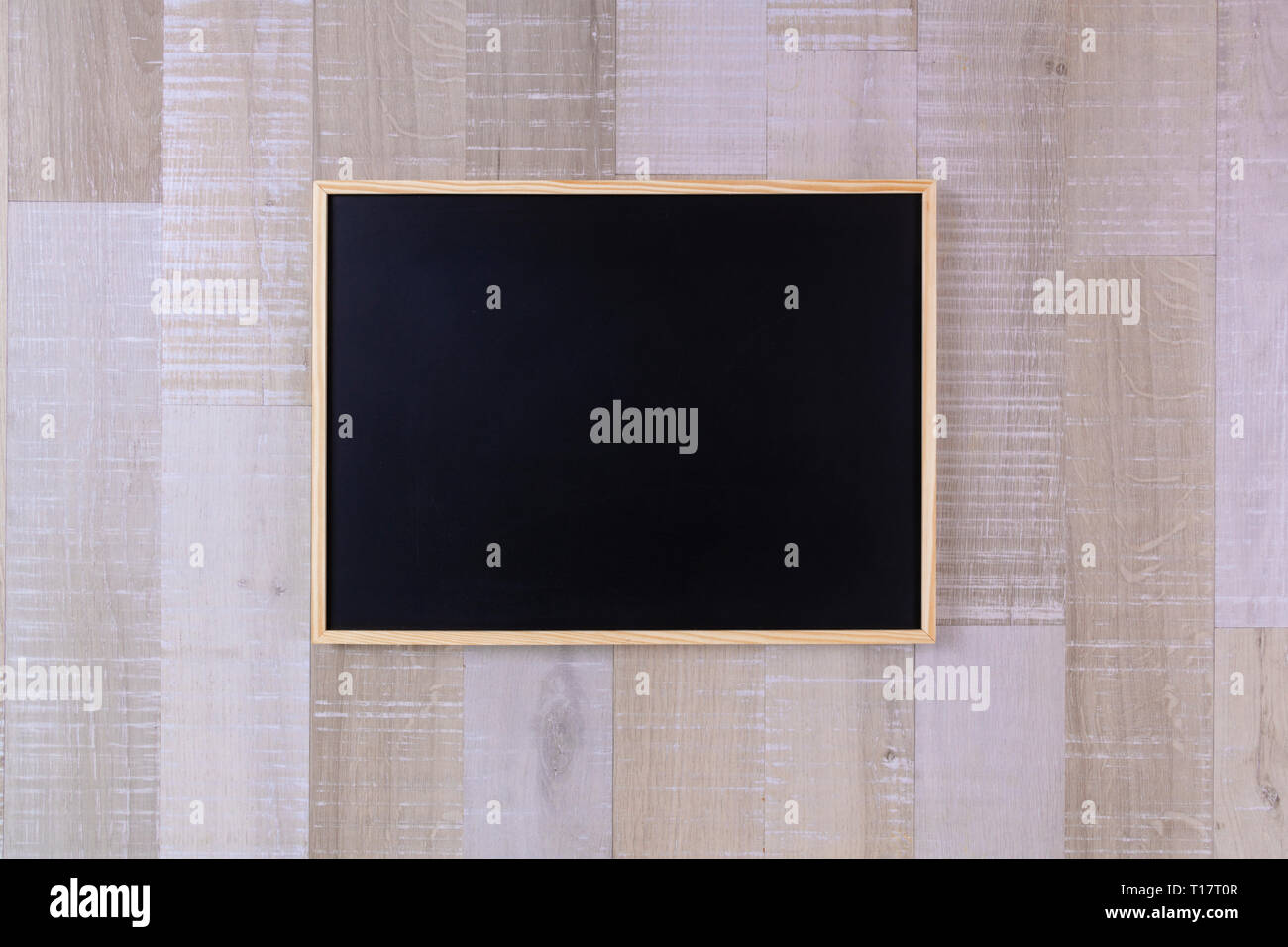 Front view of a blank blackboard over a weathered wooden surface Stock ...