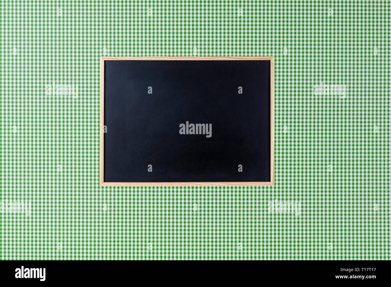 abstract , Front view of a blackboard over texture of green and white ...
