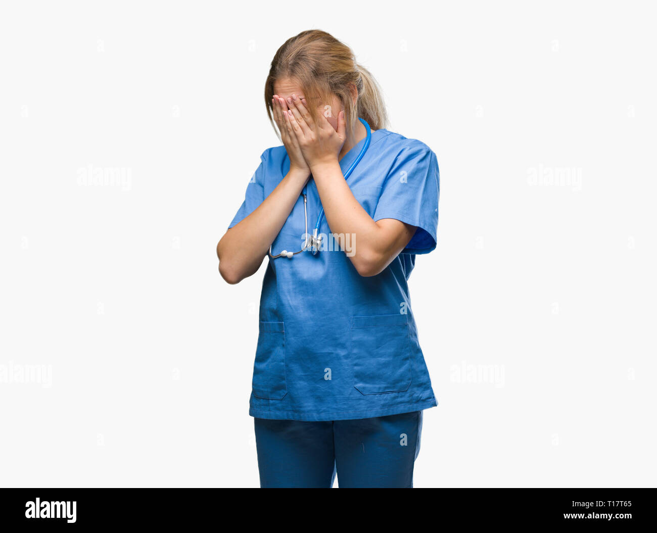 Young caucasian doctor woman wearing surgeon uniform over isolated ...